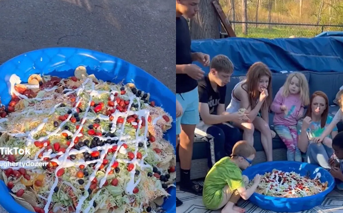 Mãe usa piscina infantil para servir comida para seus 12 filhos